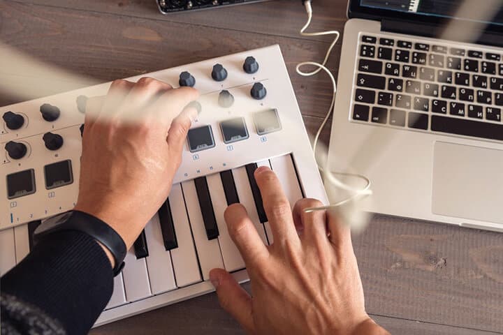 What are MIDI controllers (keyboards) and what do they do